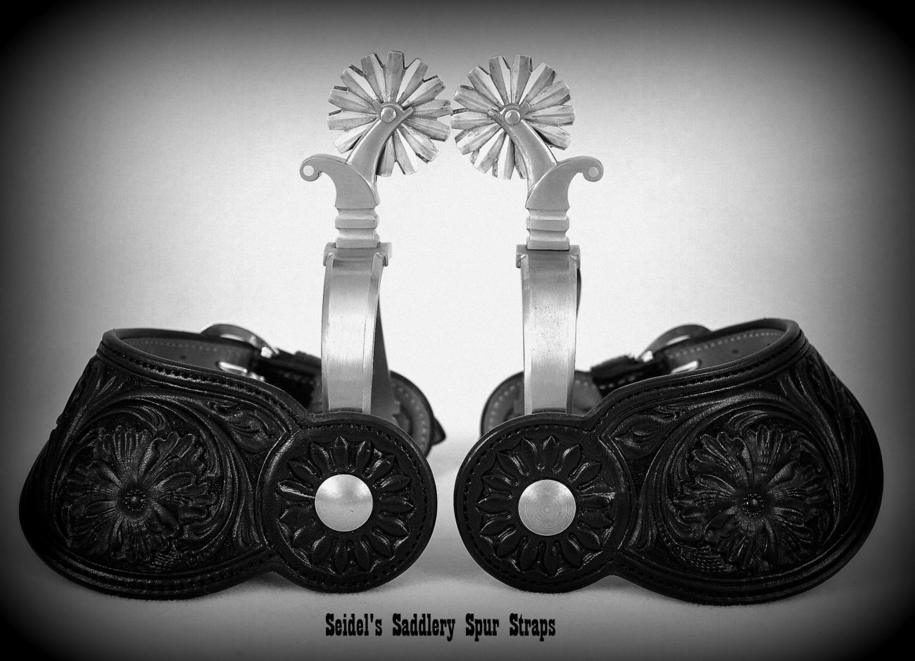 Custom Spur Straps hand tooled by Seidel's Saddlery